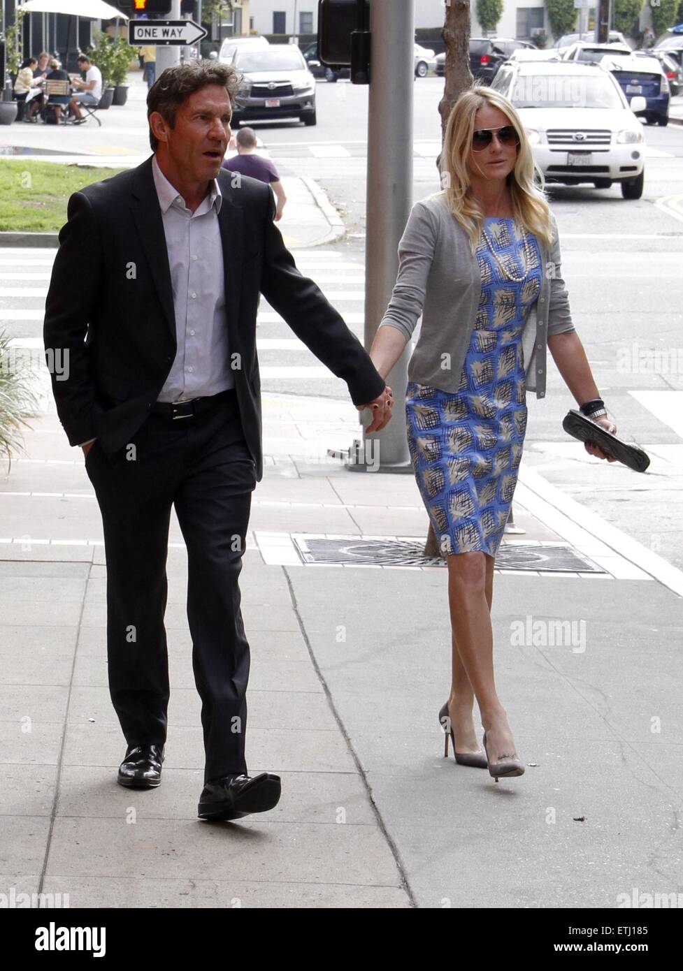 Dennis Quaid and his wife Kimberly hold hands as they leave Toscana ...