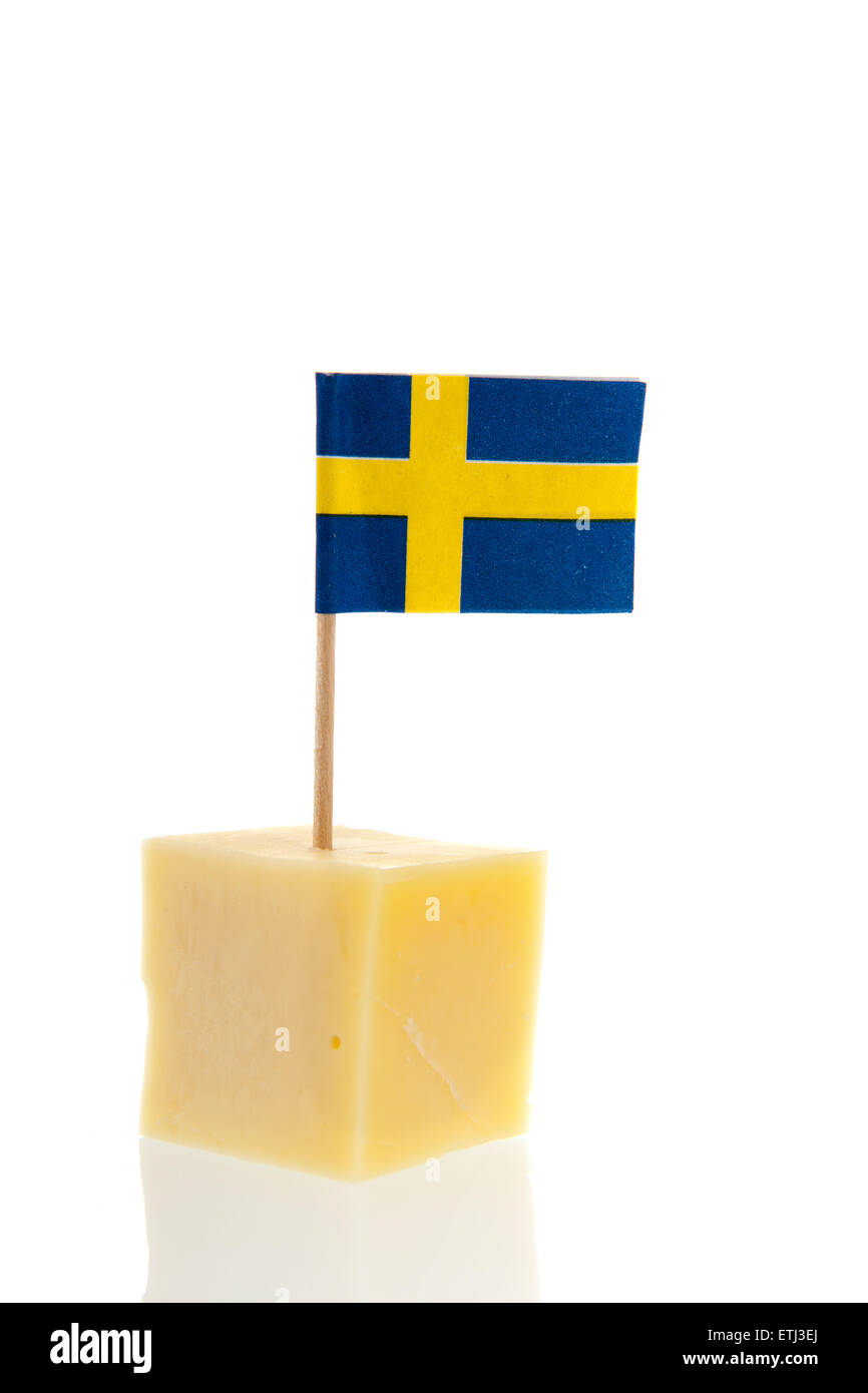 Swedish cheese cube with miniature flag isolated over white background ...