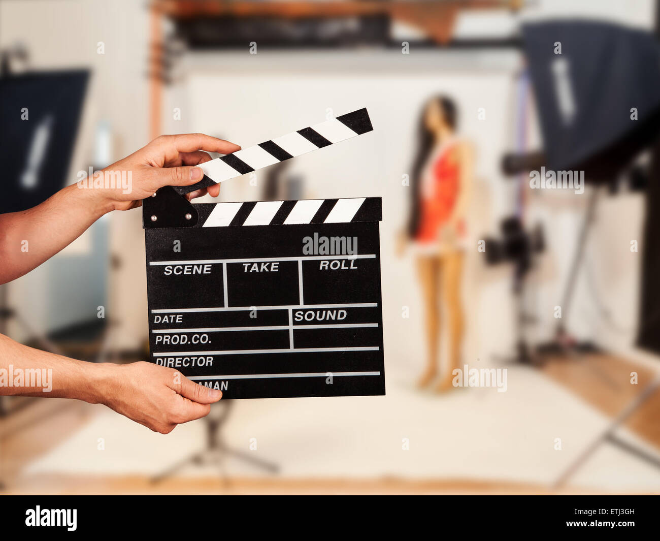 Man hands holding film clapper. Blur film studio on background Stock ...