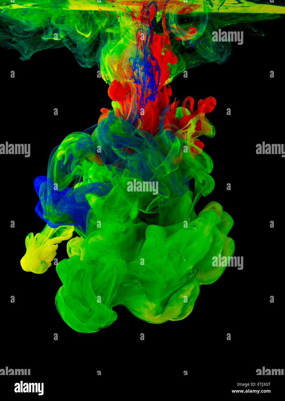 Studio shot of colored ink in water on black background Stock Photo - Alamy