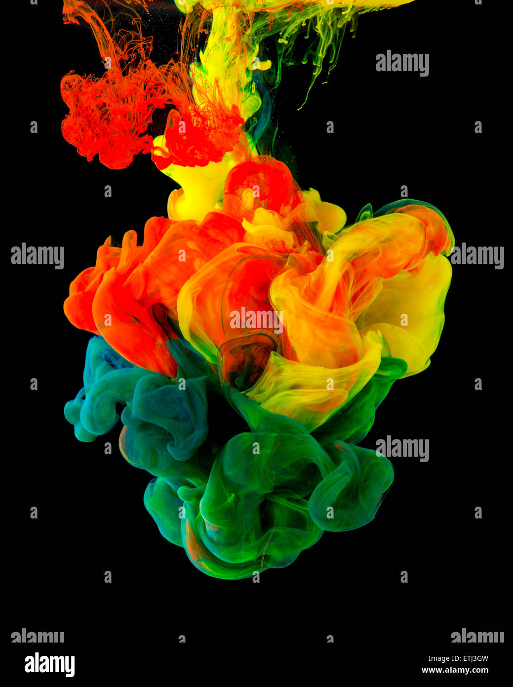 Studio shot of colored ink in water on black background Stock Photo - Alamy