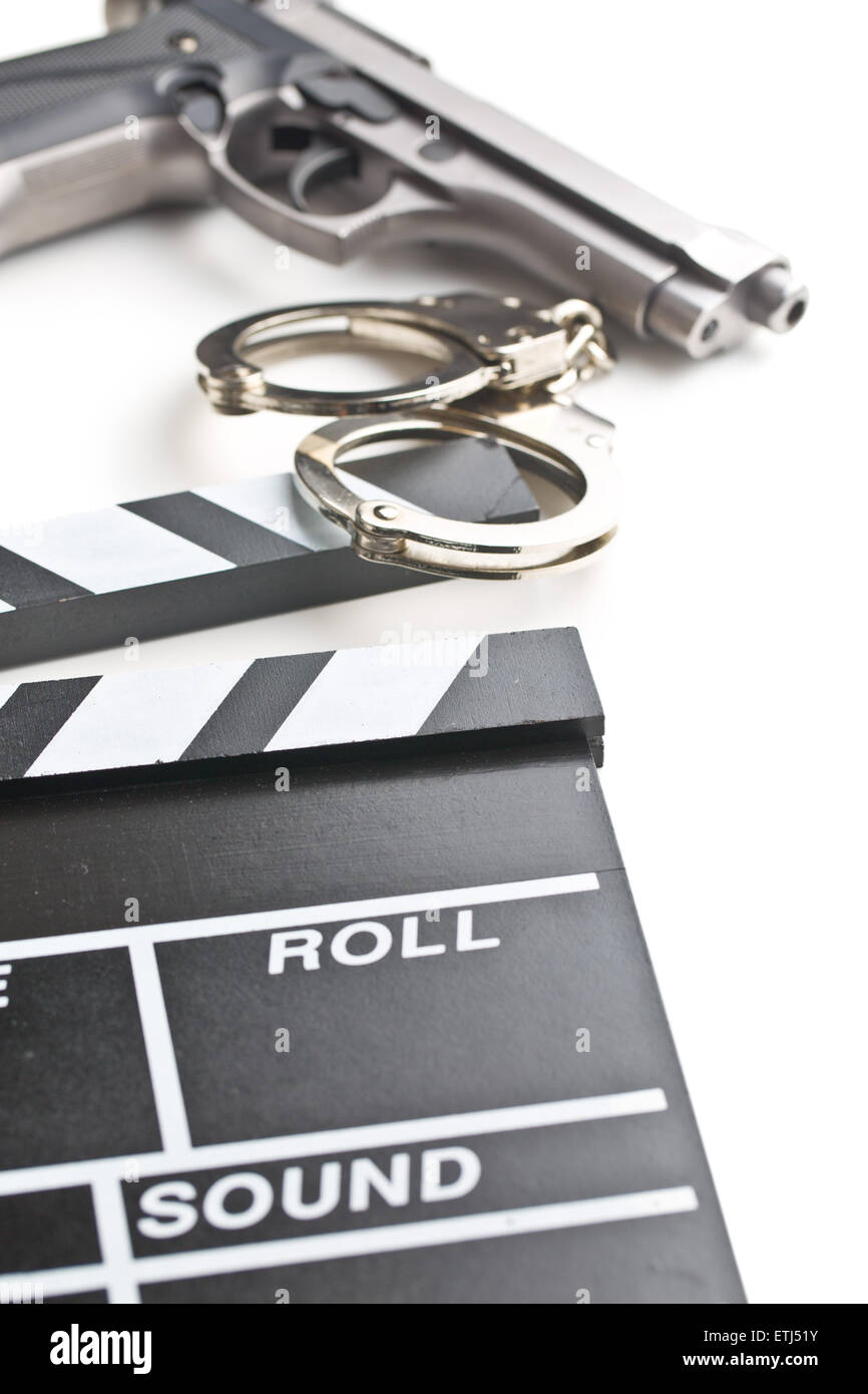 movie clapper and gun with handcuffs on white background Stock Photo ...