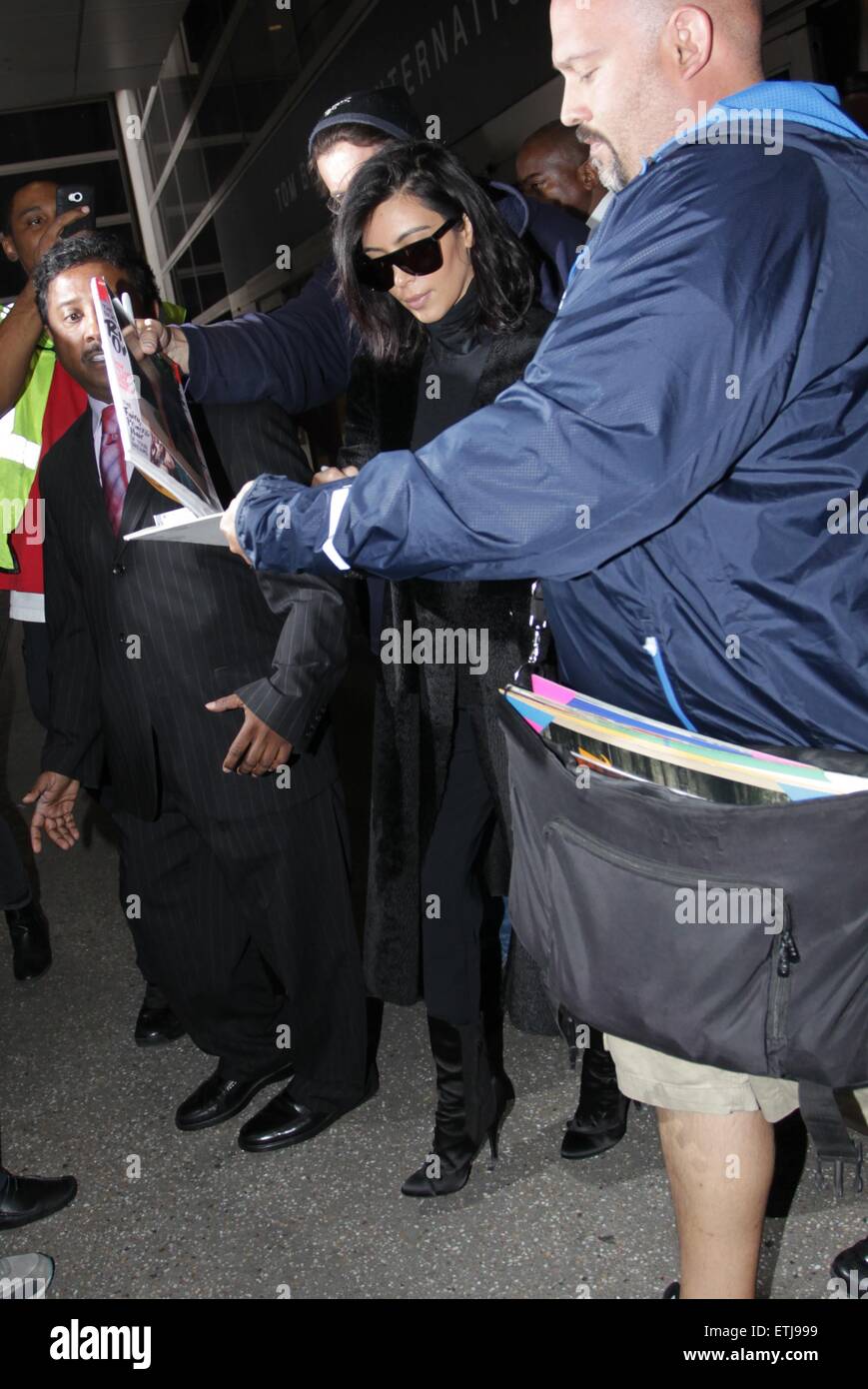 Kim Kardashian West signs autographs for fans upon her arrival at Los ...