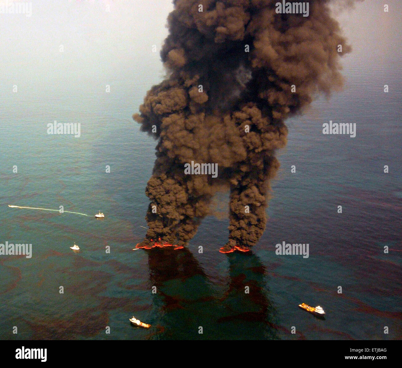 Fire boom clean up crew boats hi-res stock photography and images - Alamy