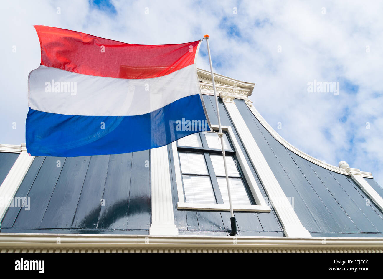 dutch flag in front of an authentic dutch house facade Stock Photo - Alamy