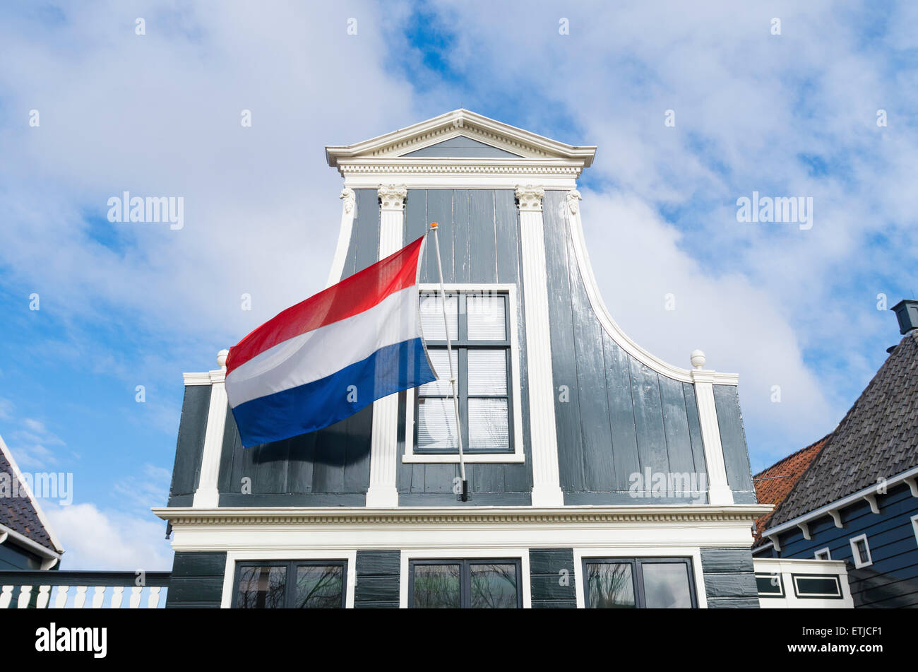 dutch flag in front of an authentic dutch house facade Stock Photo - Alamy