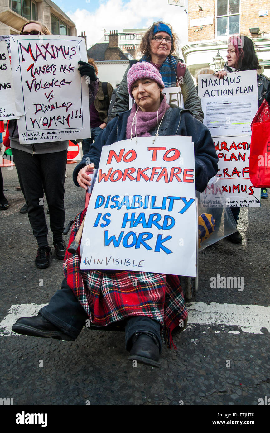 Hundreds of disabled activists protest outside the headquarters of ...
