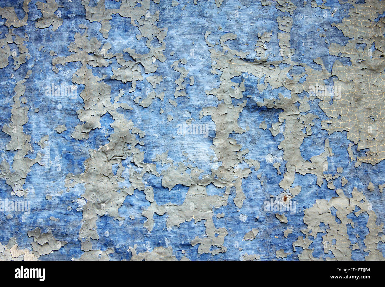 Blue plaster flaking off a wall Stock Photo - Alamy