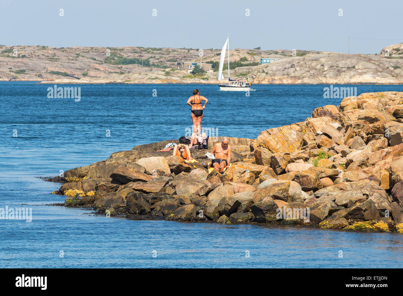 Female sunbathing on a rock hi-res stock photography and images - Alamy