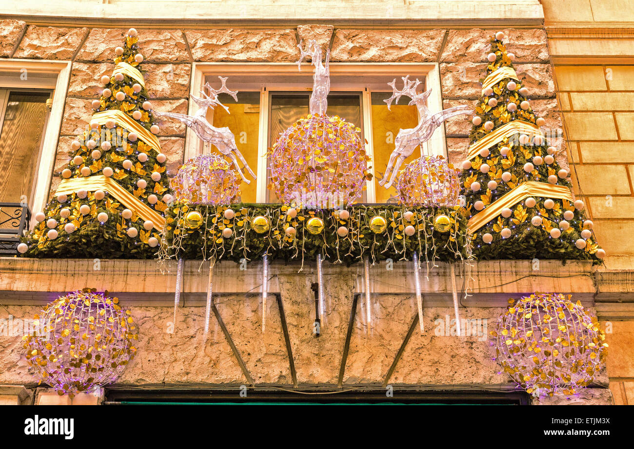 White and fuchsia Christmas lights with yellow ribbons and balls ...