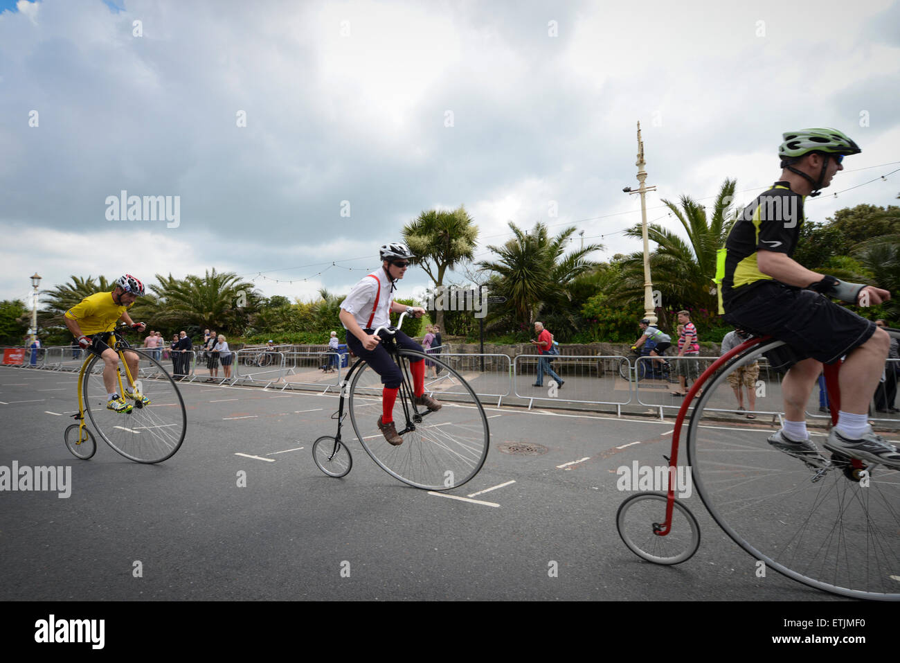 Competitors take part in the Penny Farthing Championship bike race ...