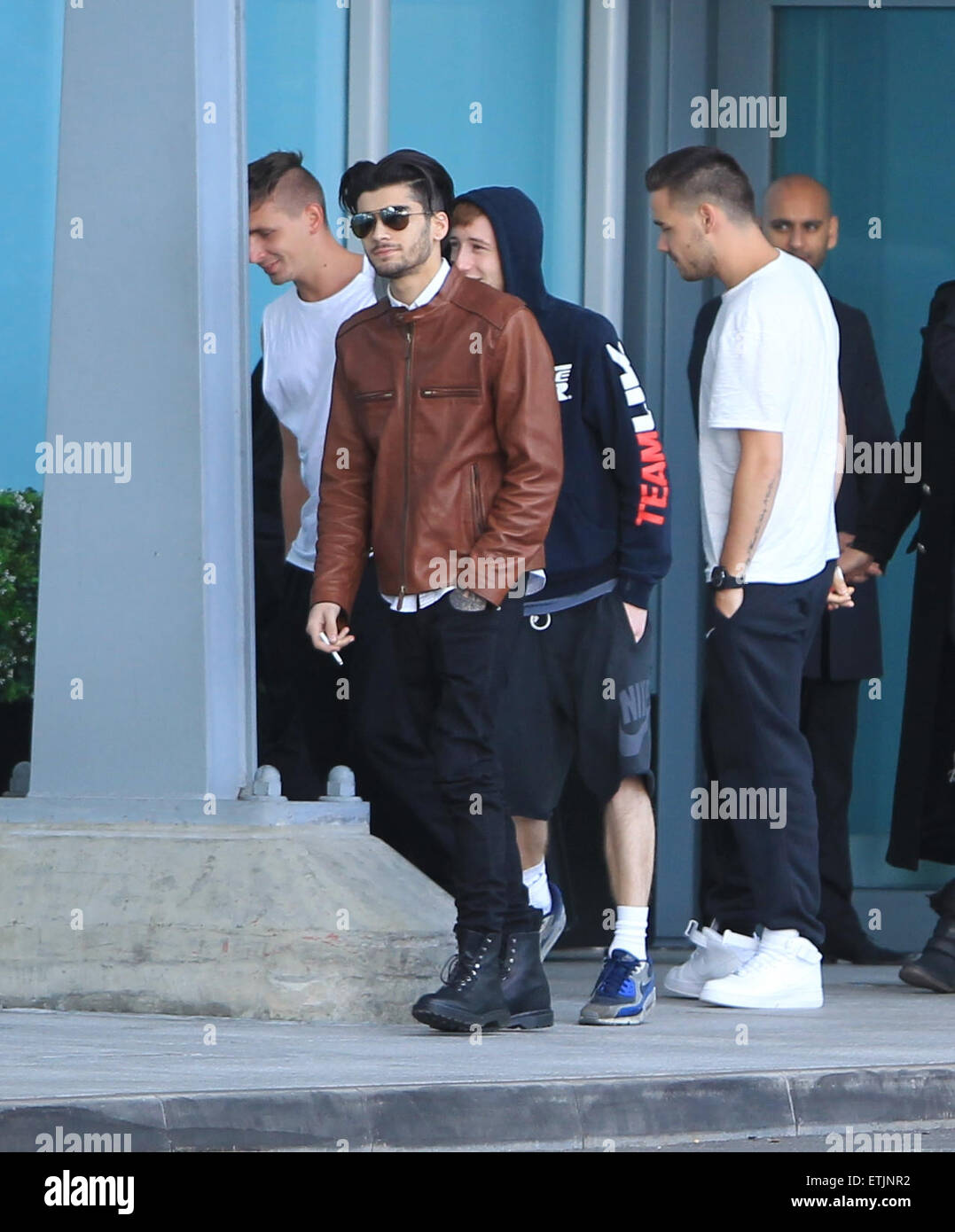 One Direction arrive back in London from the World Tour in Tokyo ...