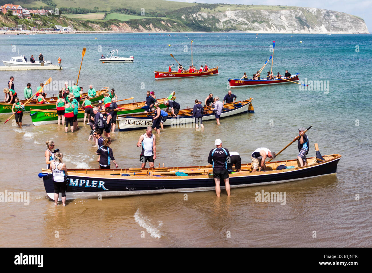 Cornish Pilot Gig Sea Rowling in Swanage Bay Stock Photo - Alamy