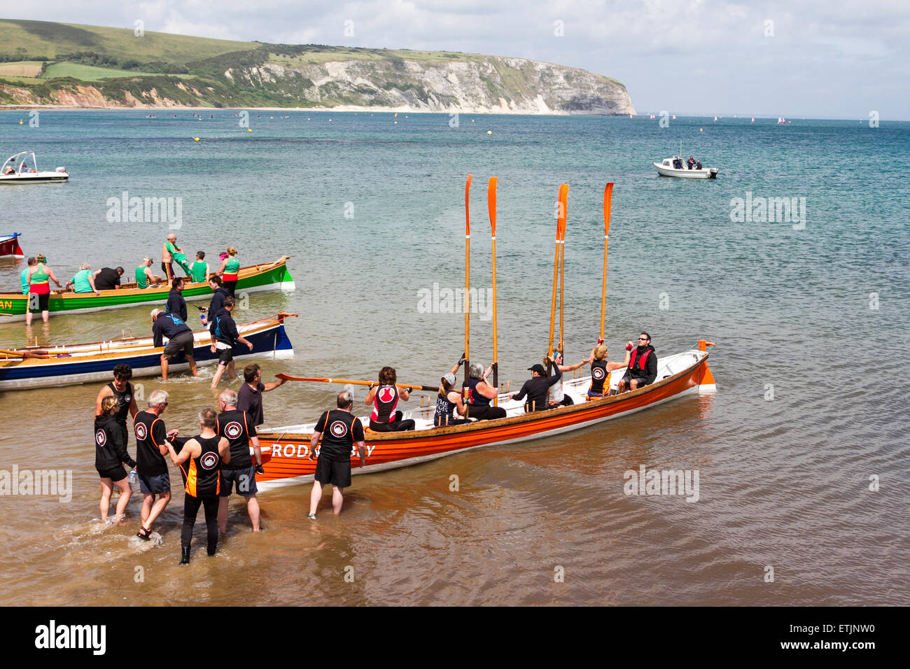 Cornish Pilot Gig Sea Rowling in Swanage Bay Stock Photo - Alamy