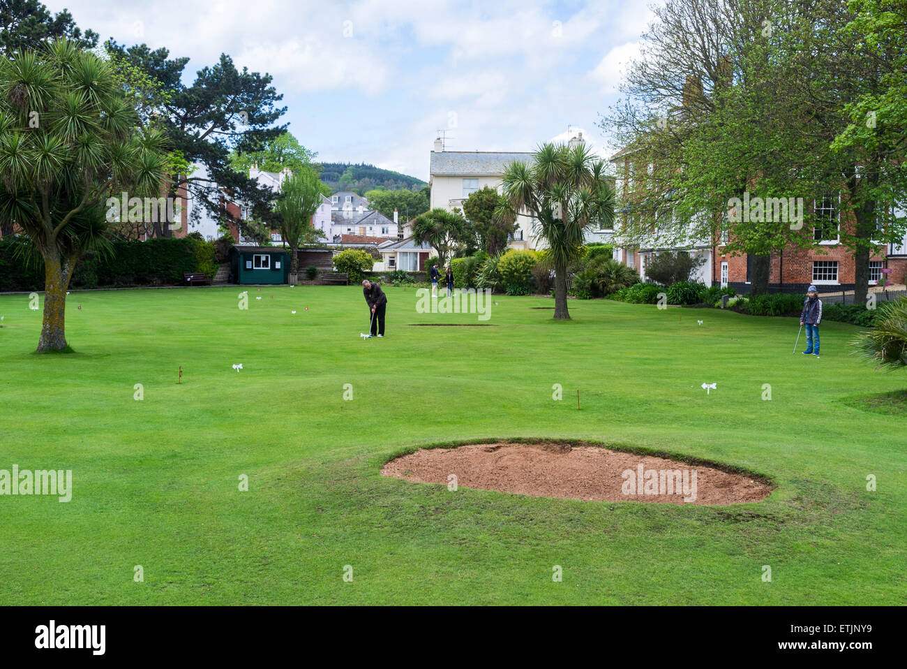Sidmouth miniature golf putting green has 18 holes and sandy bunkers ...
