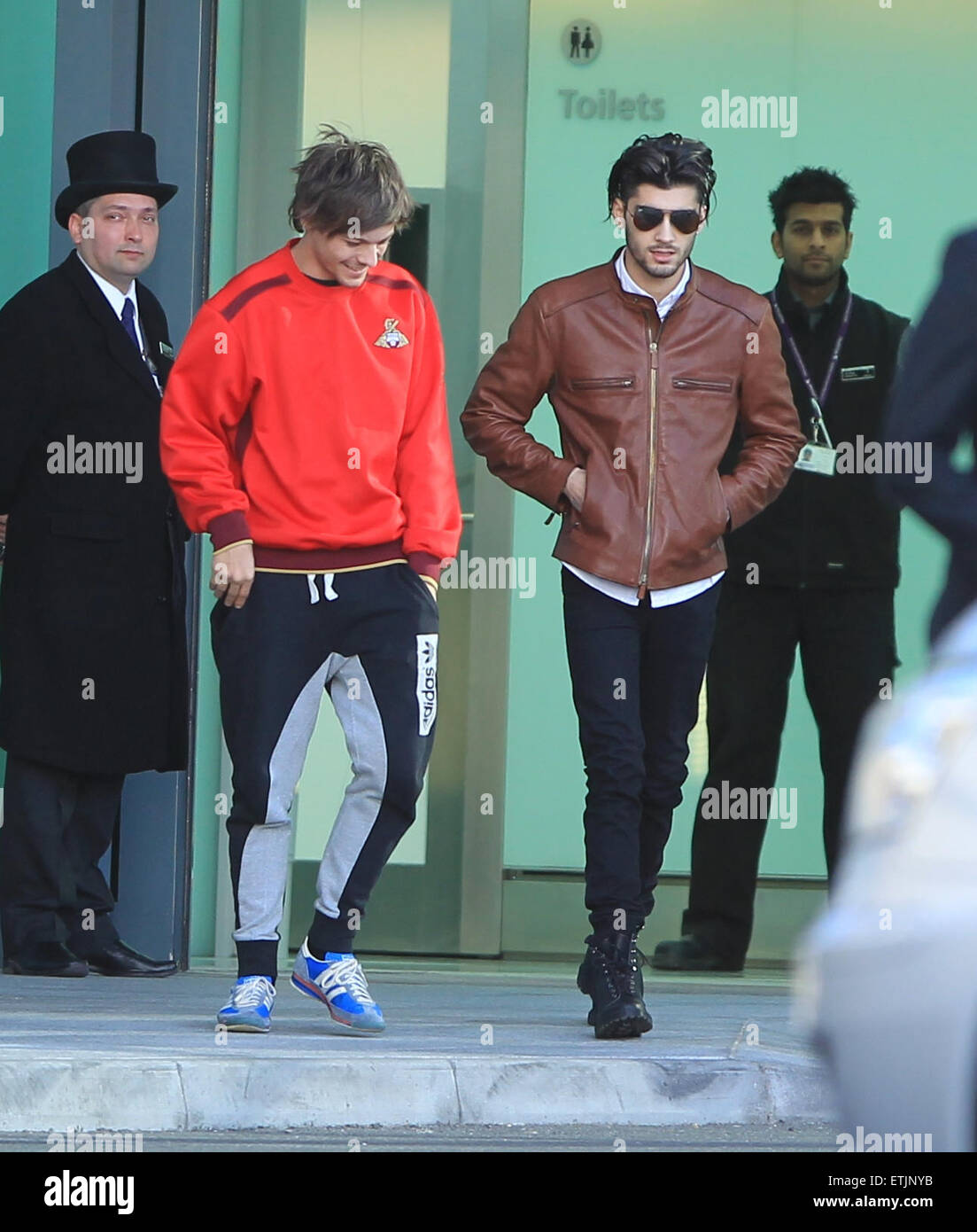 One Direction arrive back in London from their world tour in Tokyo ...