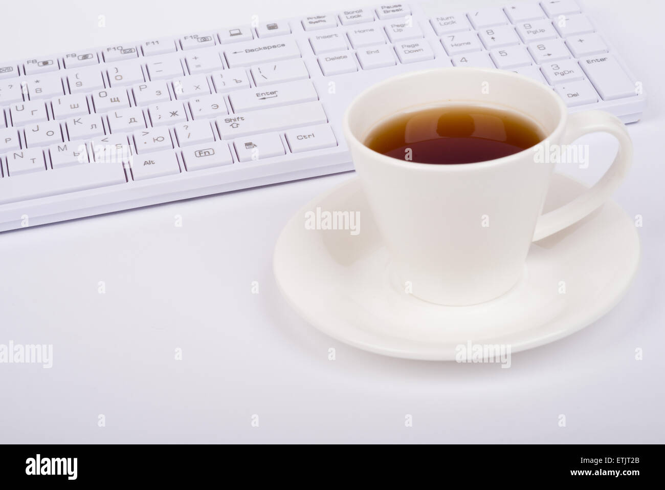 Computer keyboard and coffee cup, top view Stock Photo - Alamy