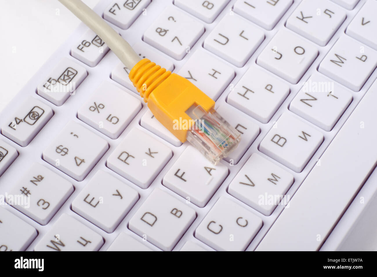 Computer keyboard with cable Stock Photo - Alamy