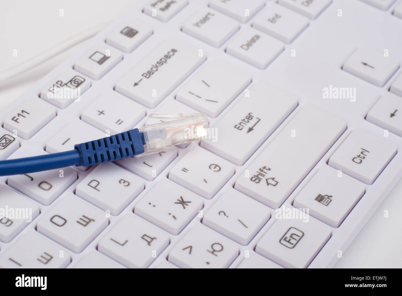 Blue computer cable with keyboard Stock Photo - Alamy