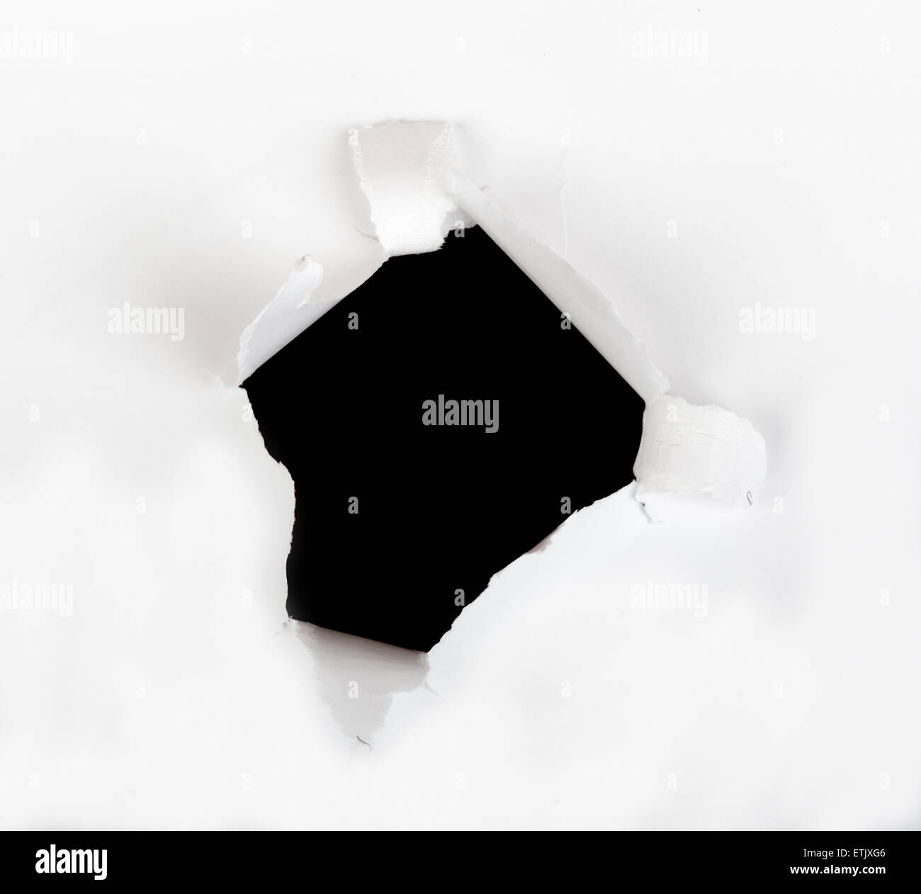 Piece of paper with hole in center Stock Photo - Alamy