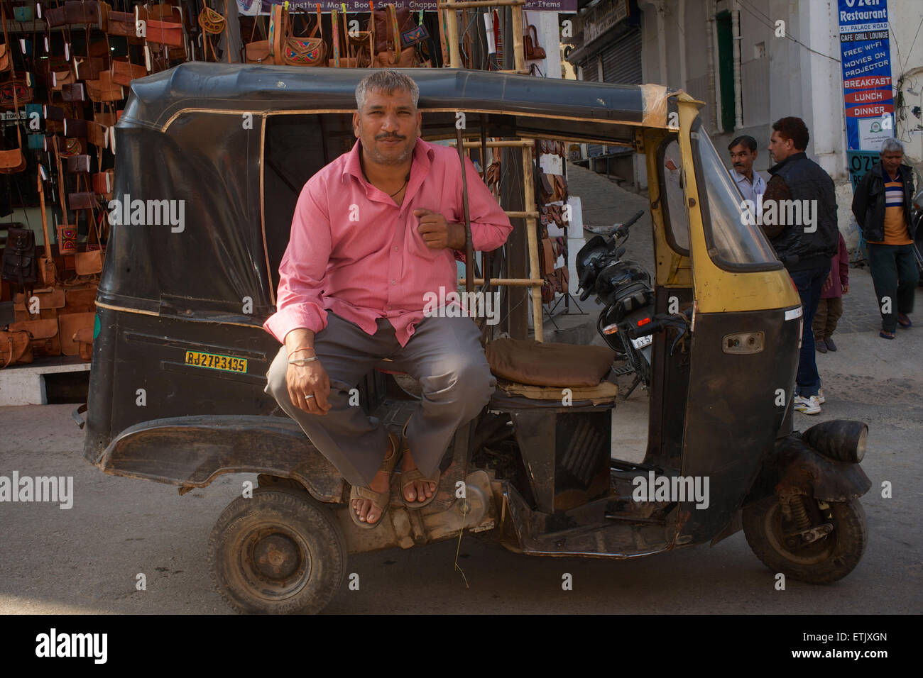 Auto rickshaw driver and his tuktuk, Udaipur, Rajasthan, India Stock ...