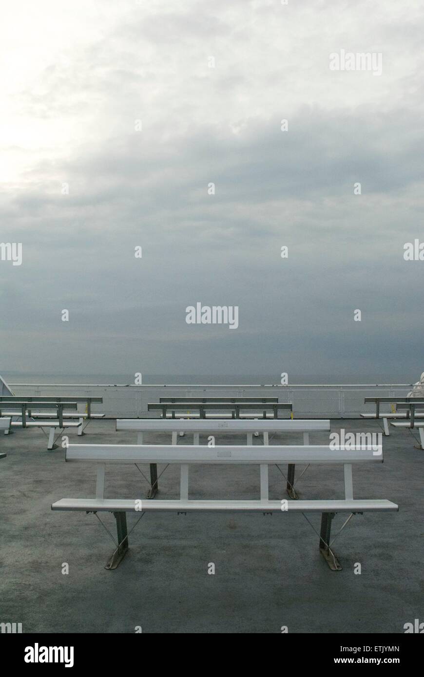 white benches on a ferry Stock Photo - Alamy