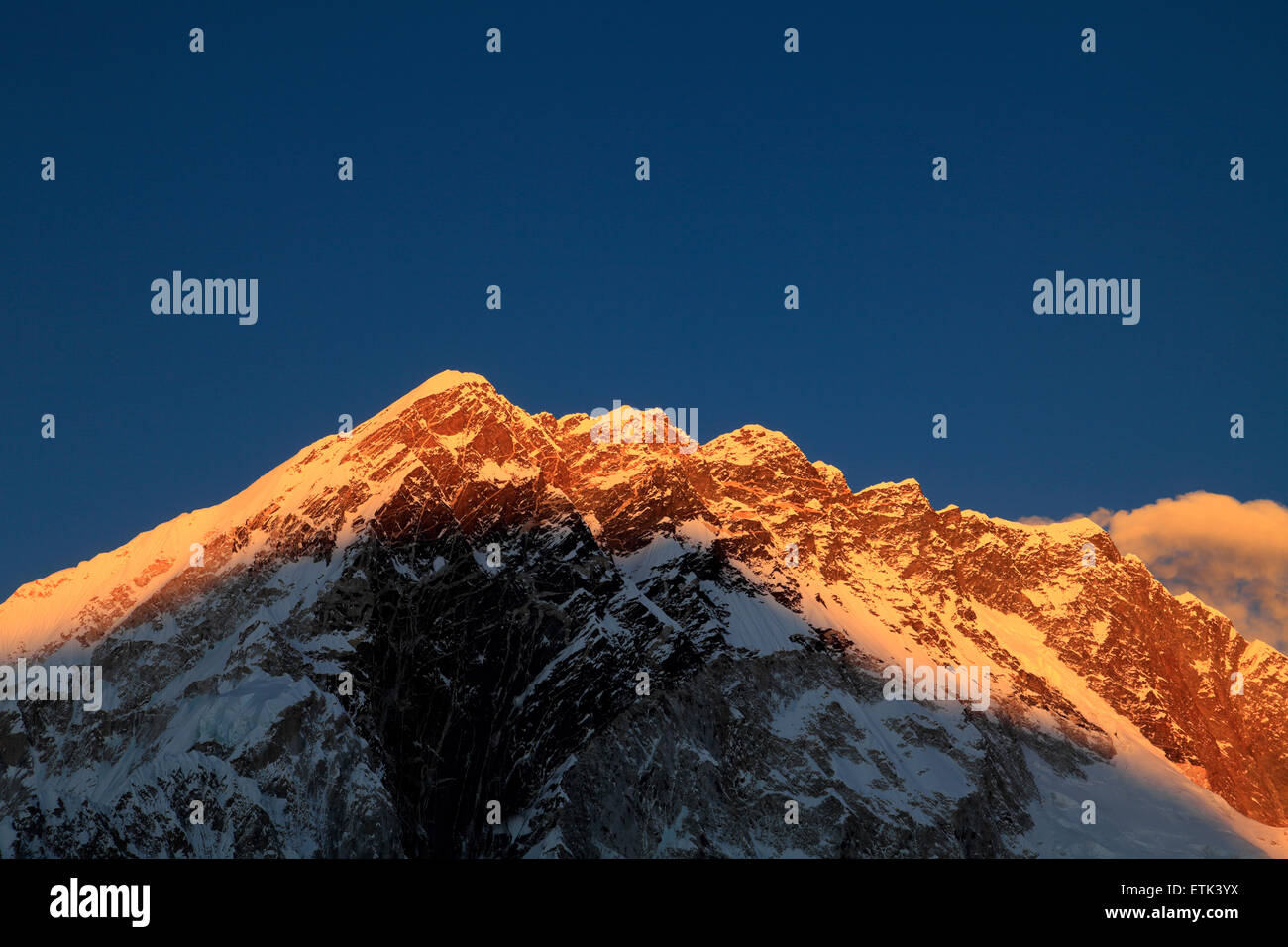 Sunset over the Summit of Nuptse mountain (7864 M), Everest base camp ...