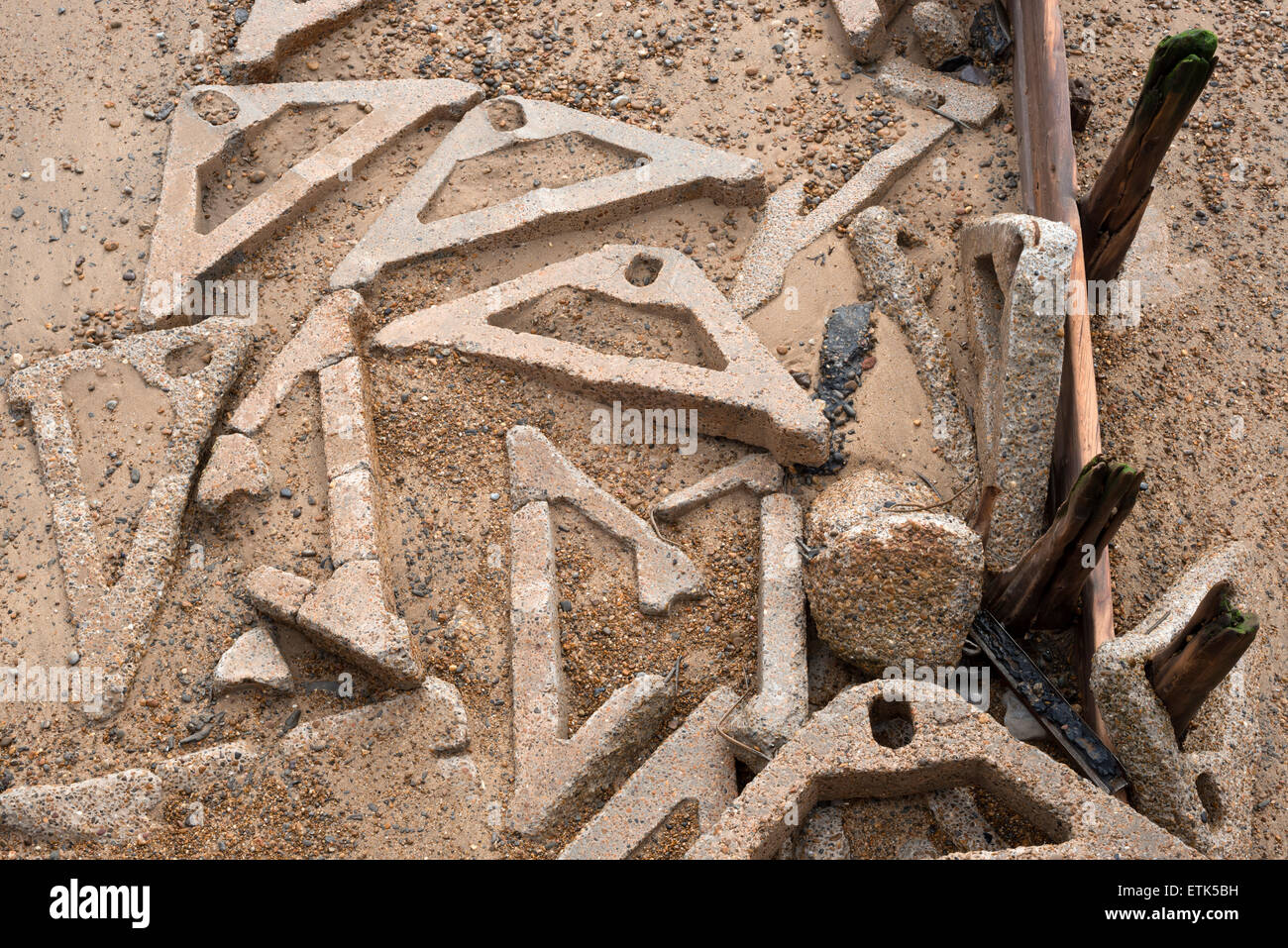 Scatted concrete frames from a broken breakwater Stock Photo - Alamy