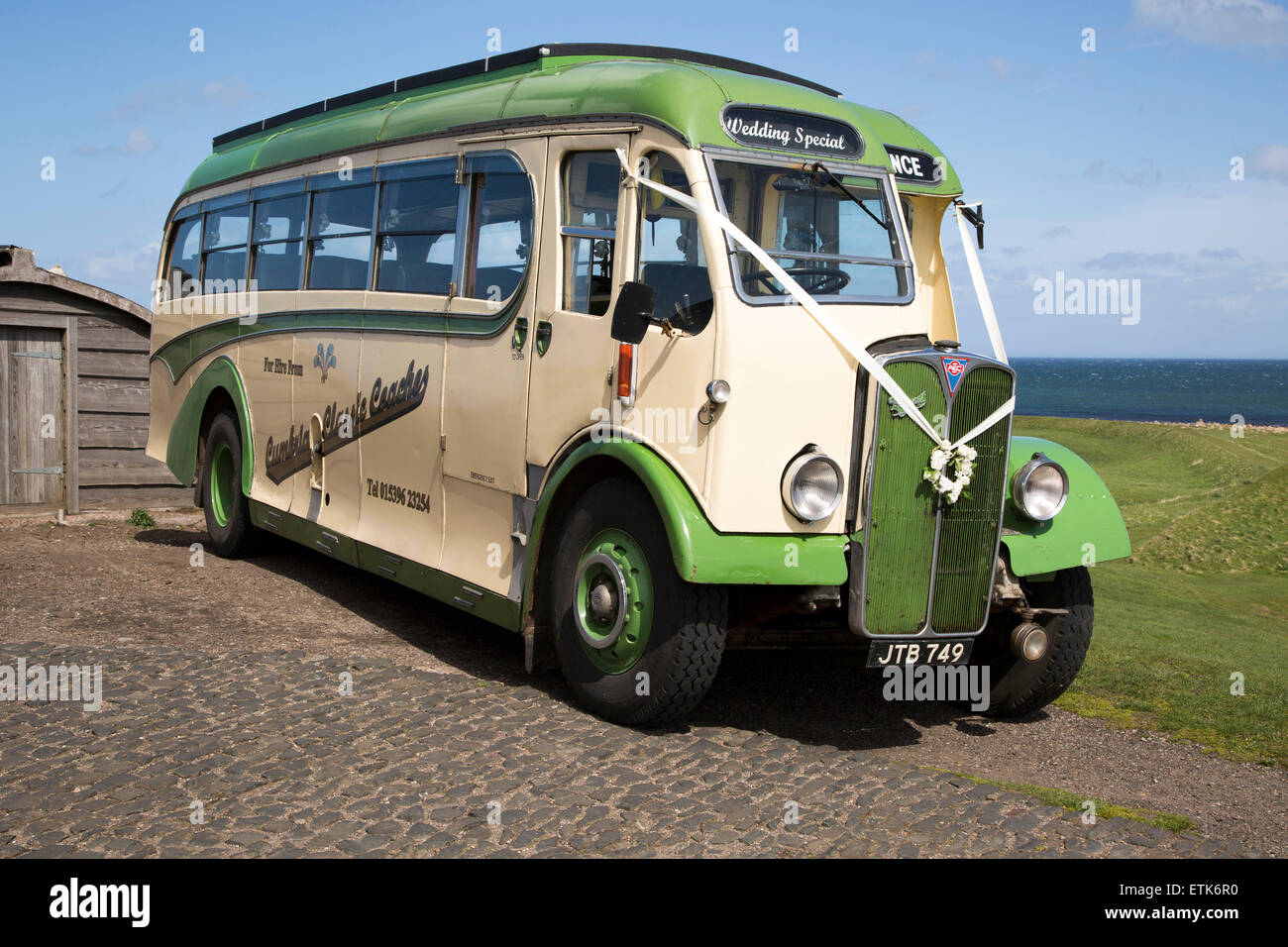 Antique motor coach seen on holy island hi-res stock photography and ...