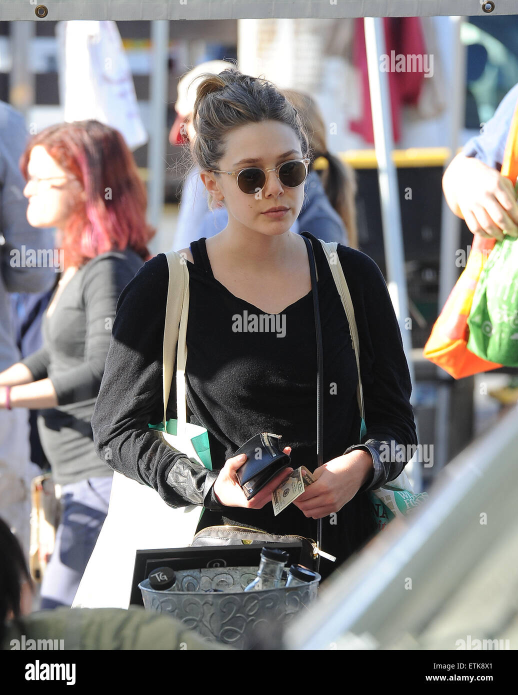 Elizabeth Olsen picks up produce and Kombucha probiotic juice at the ...