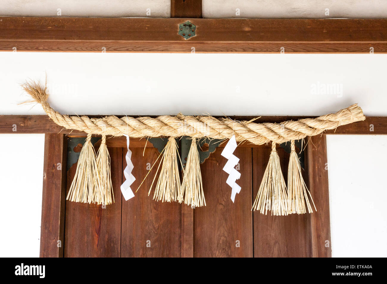 Japan, Kyoto, Okazaki temple. Shimenawa, straw twisted rope, hanging ...