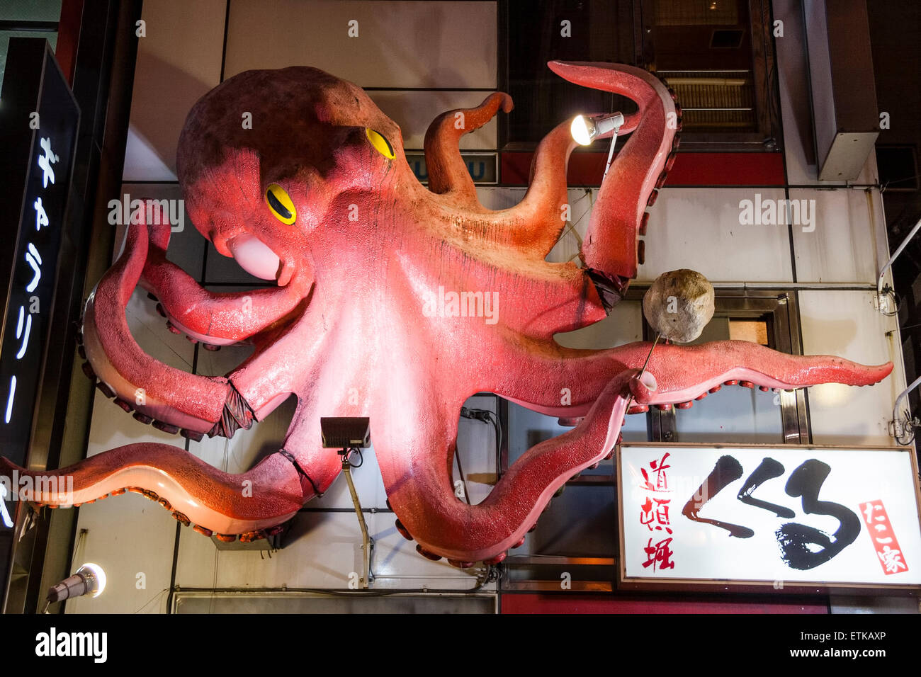 Japan, Osaka, Dotonbori. Night time. Close up of the illuminated pink ...