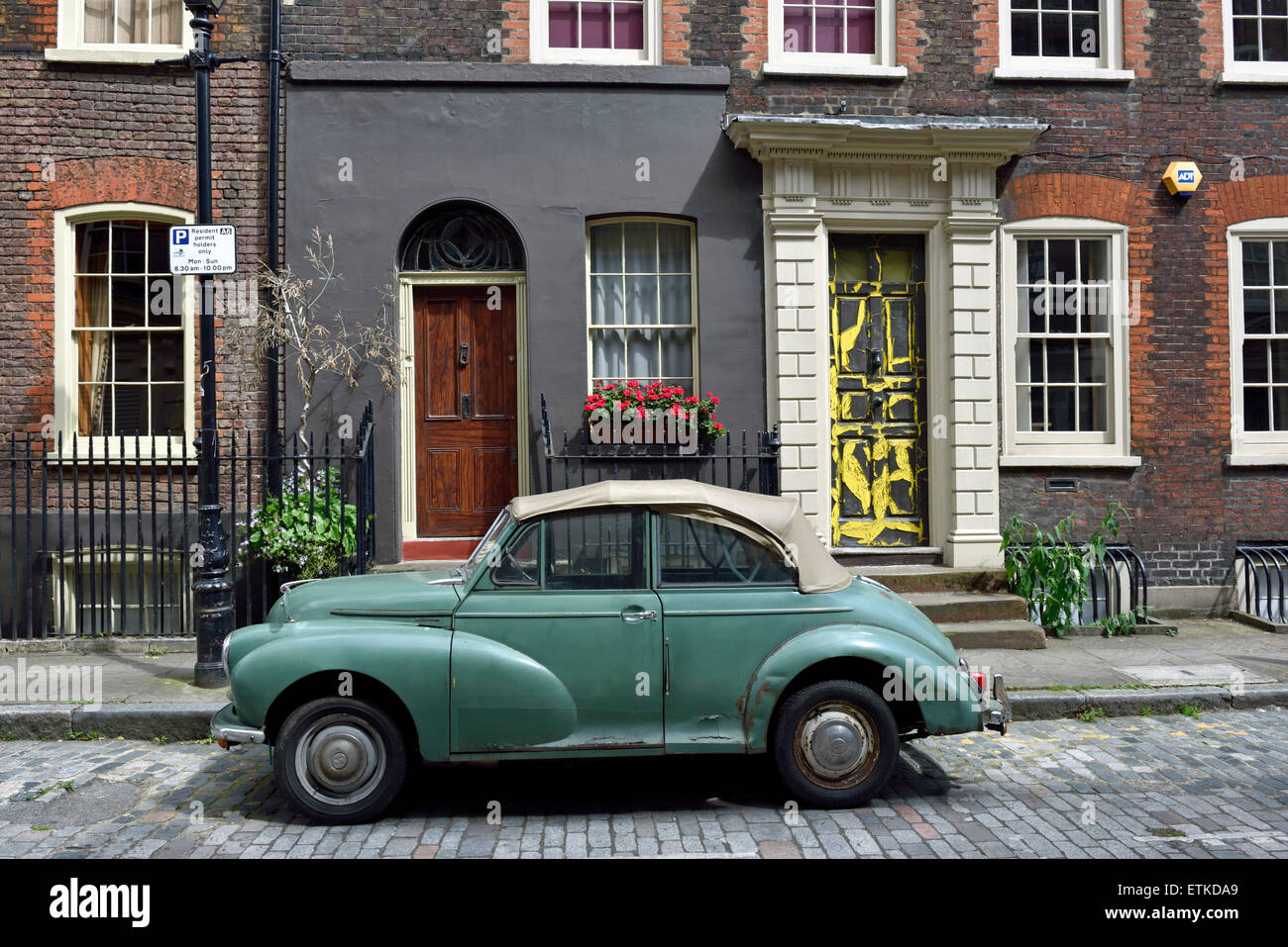 Convertible Morris Minor with split windscreen, pre 1956 parked in ...