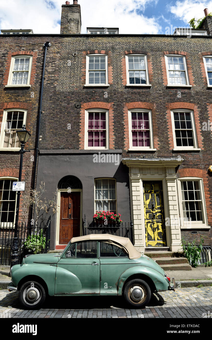 Convertible Morris Minor with split windscreen pre 1956 parked in front ...