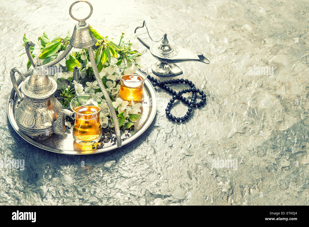 Tea table setting with arabian lantern and rosary. Islamic holidays ...