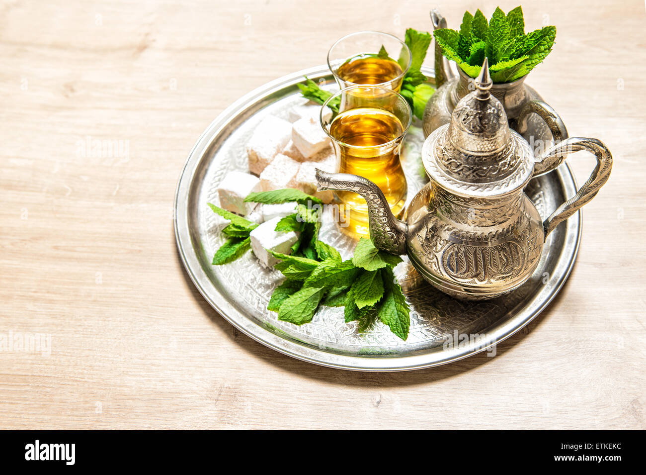 Tea with mint leaves and traditional turkish delight. Oriental ...
