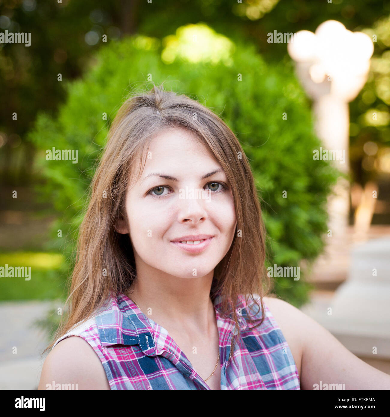 Nice smiling girl at park, sunny day Stock Photo - Alamy