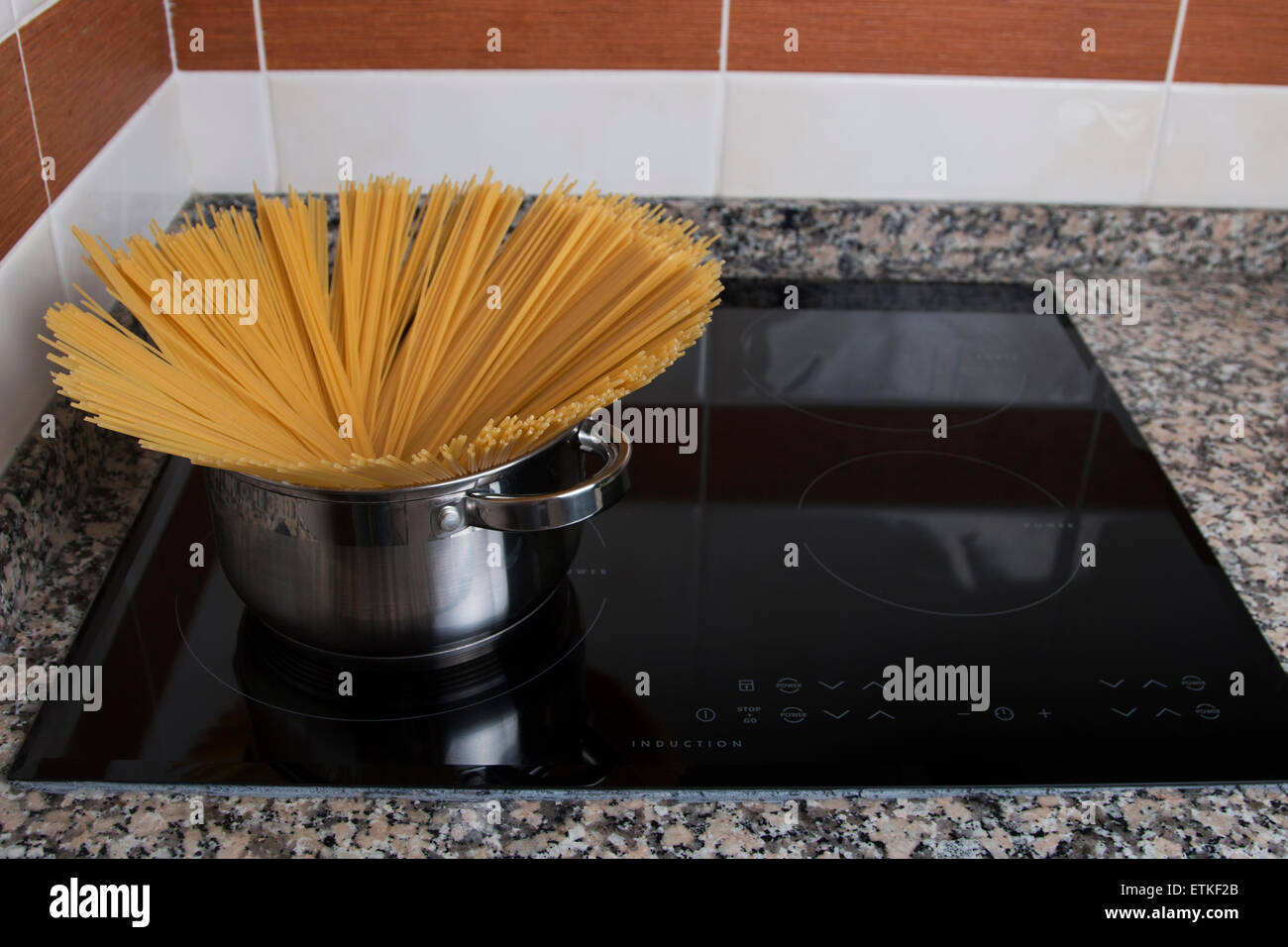 Close up view of pile spaghetti inside a pan Stock Photo - Alamy