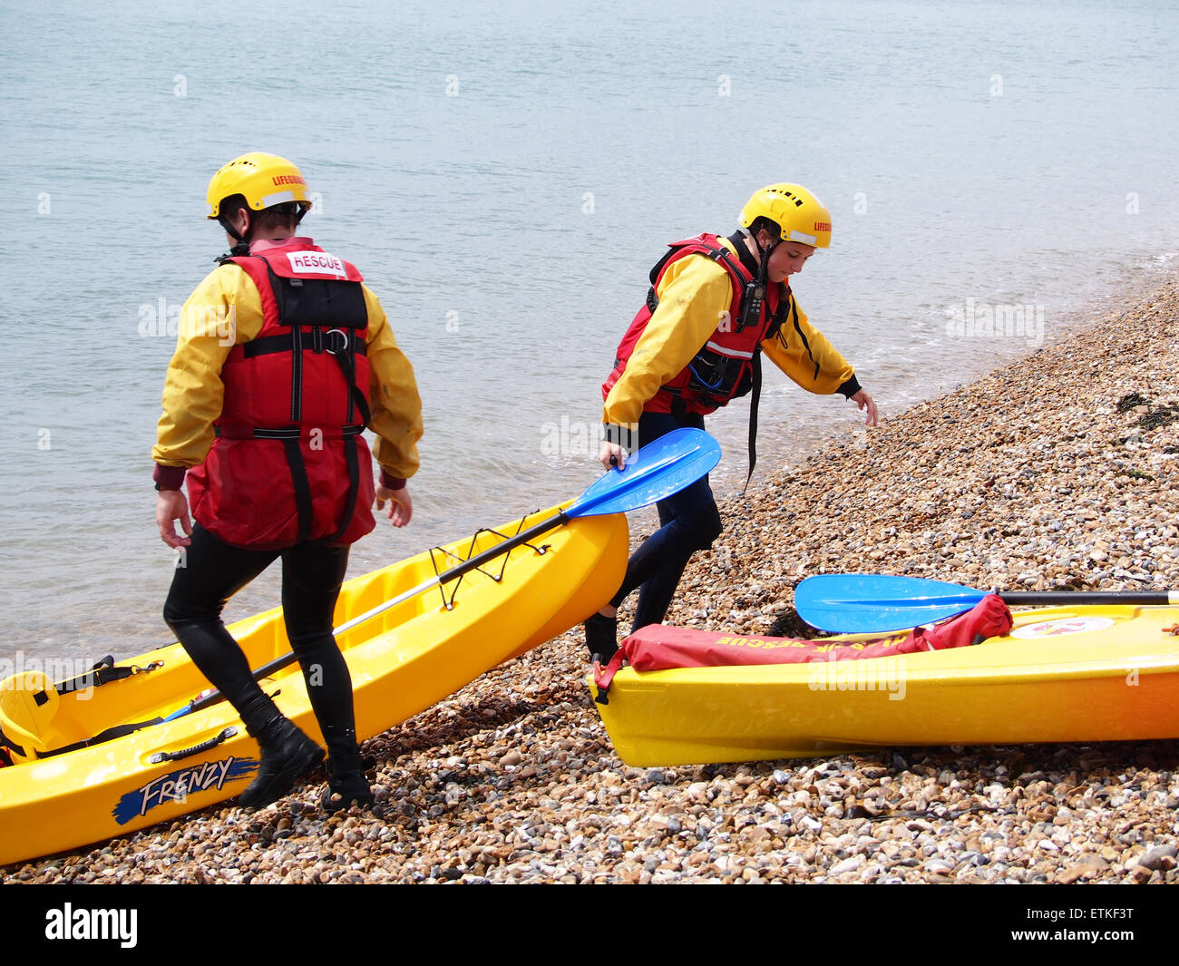 RLSS Lifeguards pull their kayaks onto Southsea beach, Portsmouth ...