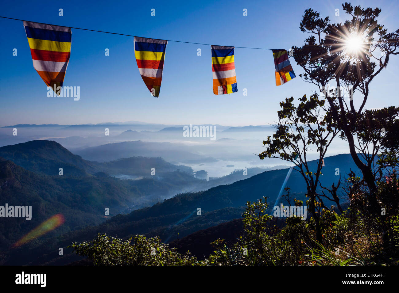 Adam's Peak (Sri Pada), misty mountain view with Buddhist flags ...