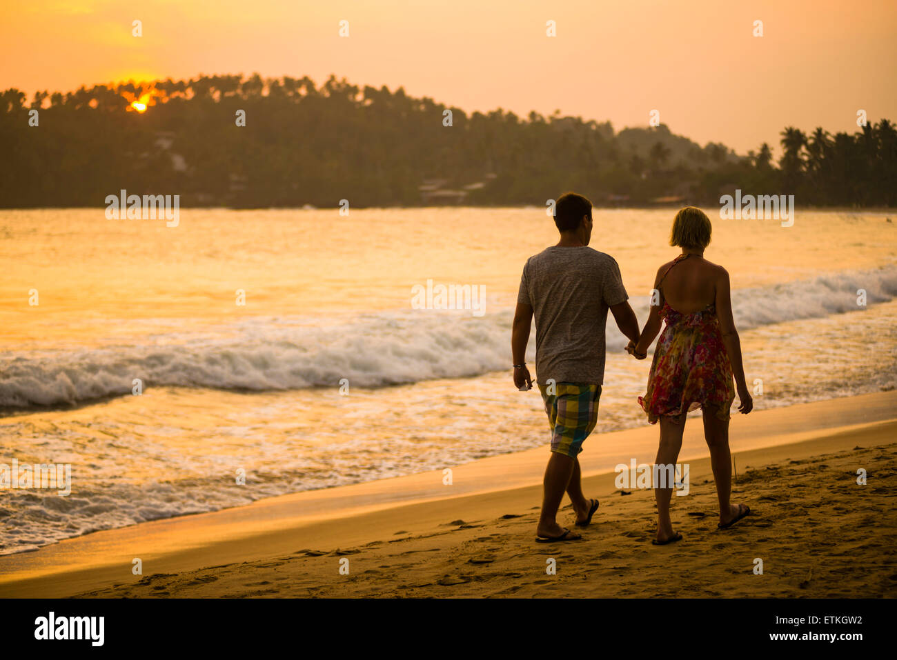 Mirissa Beach, couple taking a romantic walk at sunset, South Coast of ...