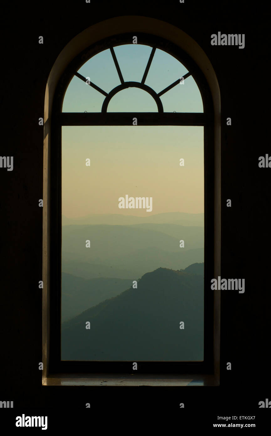 View through an arched window in the Monsoon Palace, Udaipur. Rajasthan ...