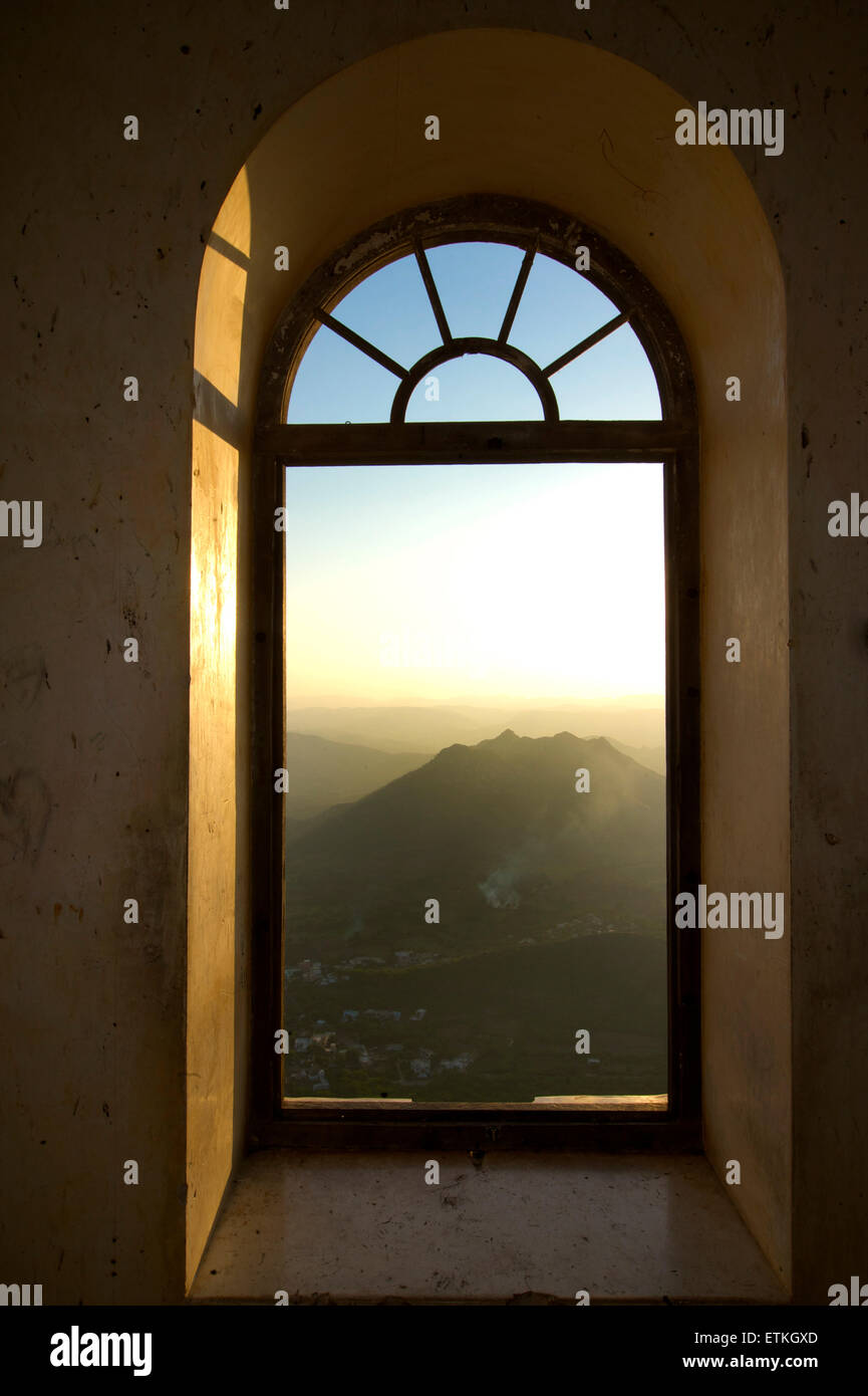 View through an arched window in the Monsoon Palace, Udaipur. Rajasthan ...