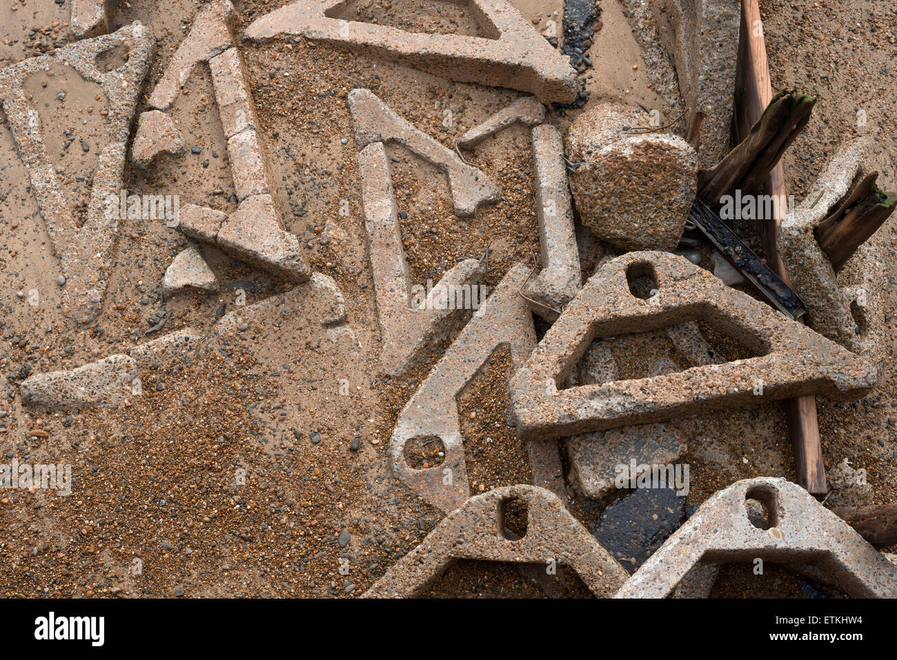 Scatted concrete frames from a broken breakwater Stock Photo - Alamy