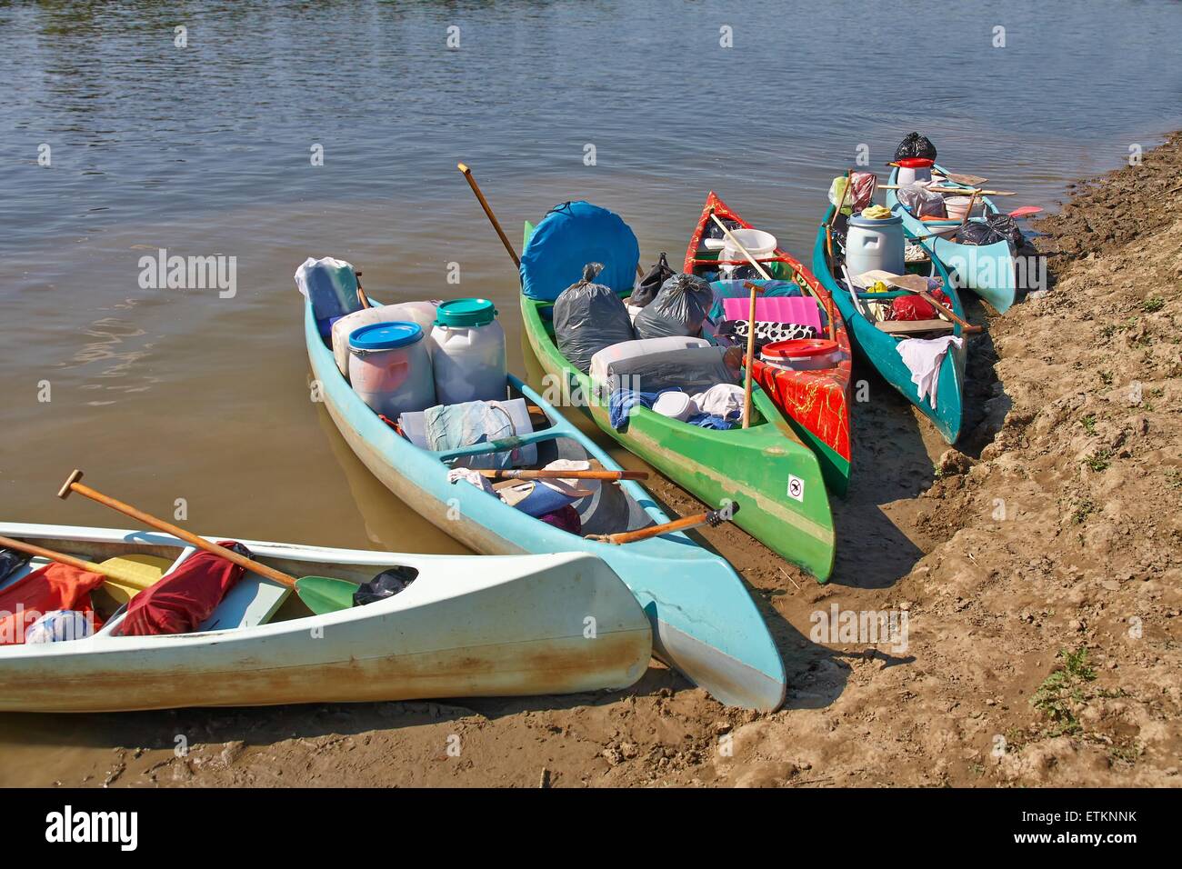 Canoes on the Riverside Stock Photo - Alamy