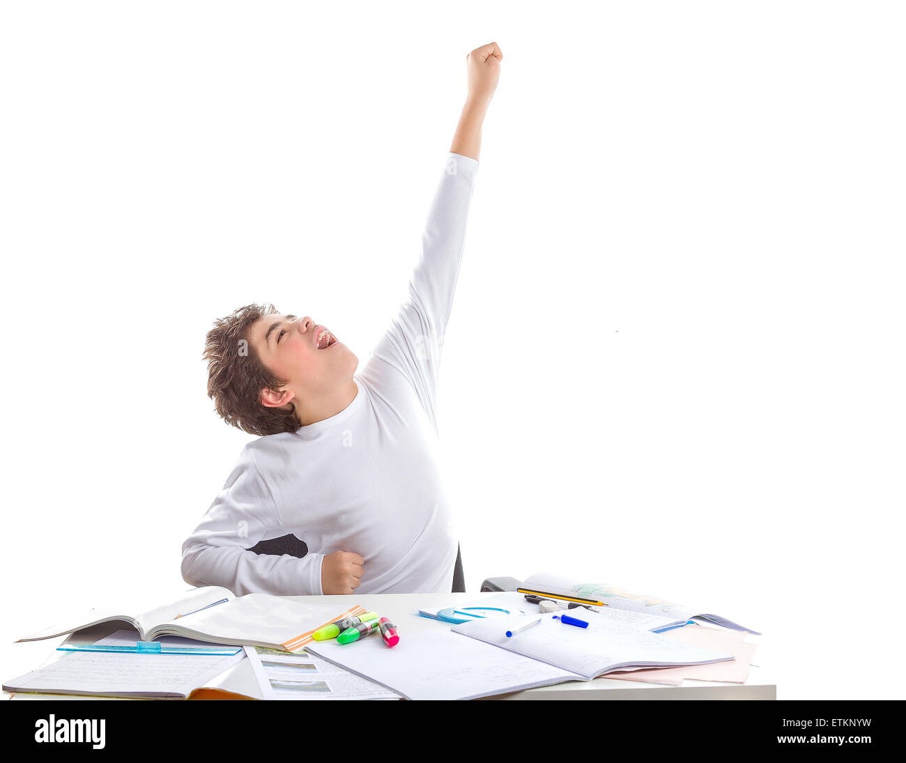 Latin Teenager boy sitting while doing homework poses as a superhero ...