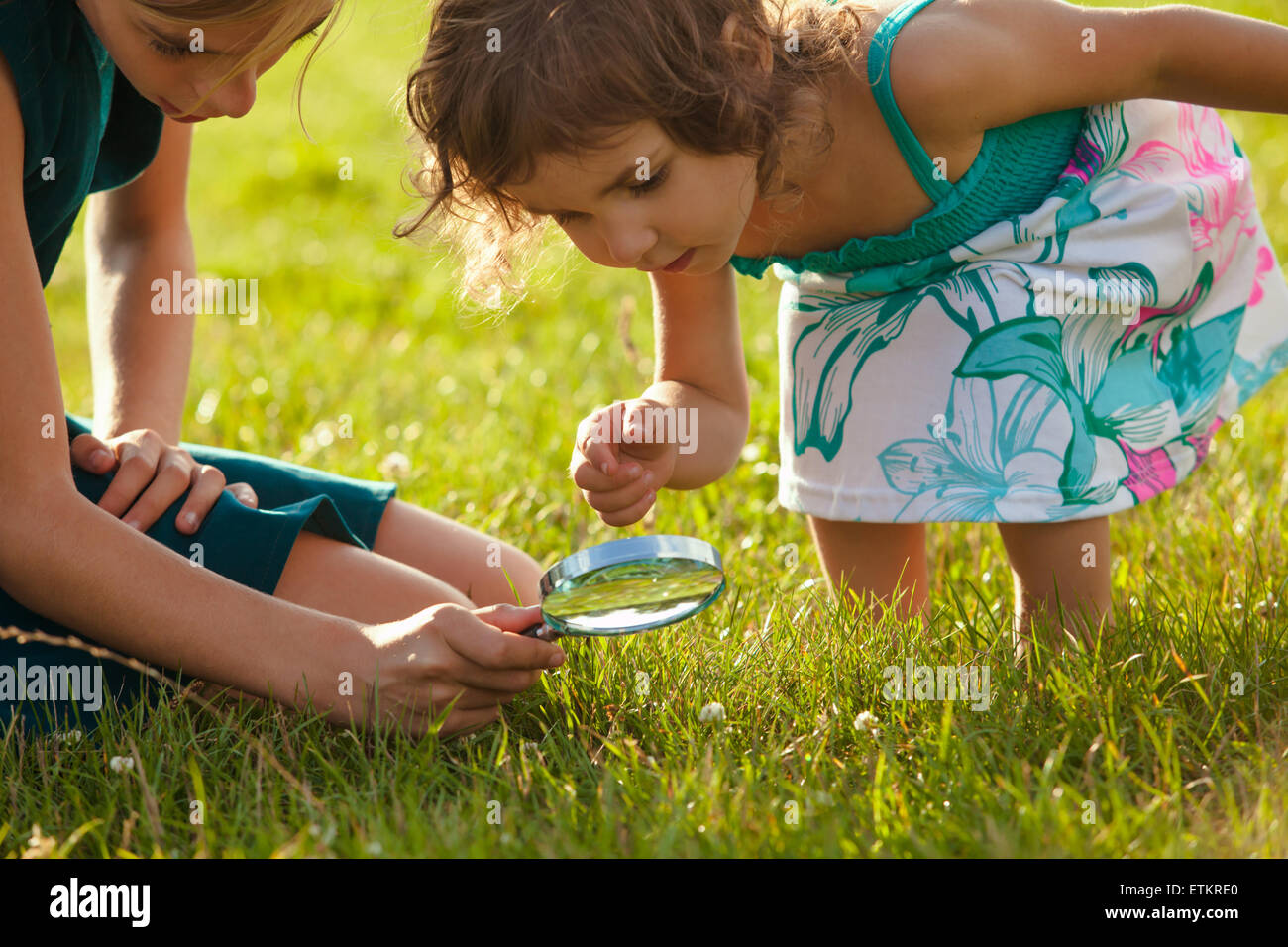 Kid with magnifying glass Stock Photo - Alamy