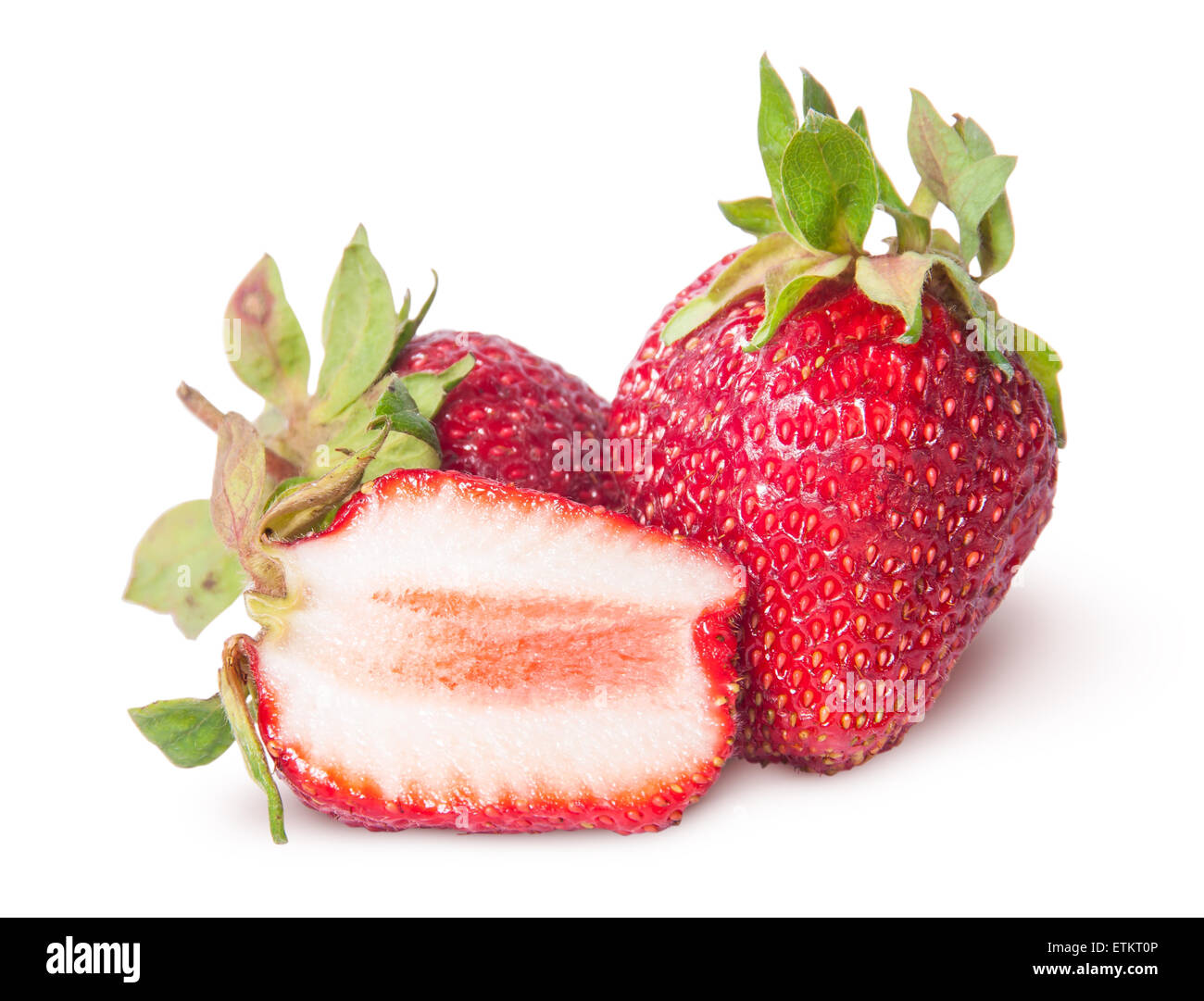 Two freshly whole and half strawberries isolated on white background ...