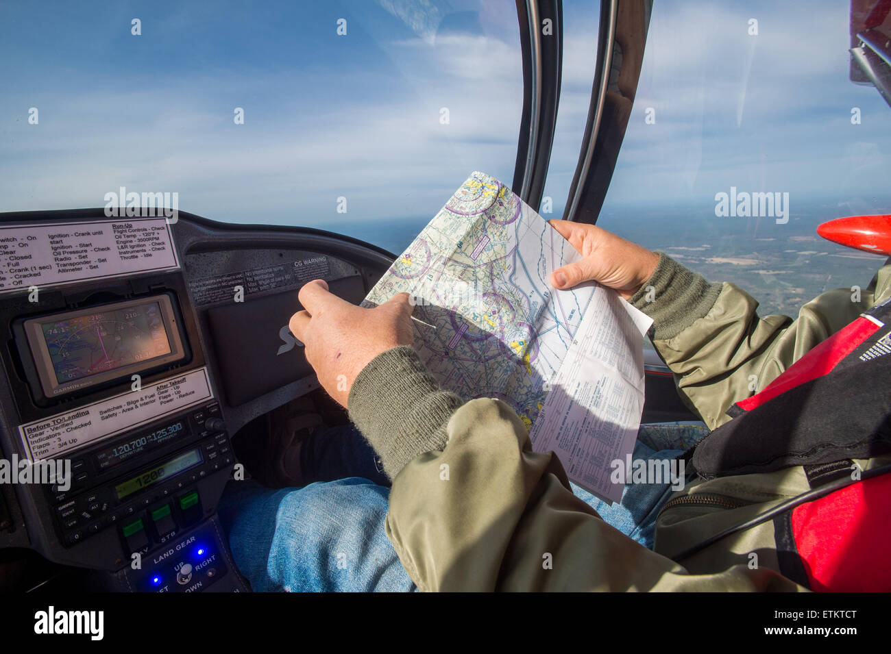 Pilot looking at map in Searey seaplane USA Stock Photo - Alamy