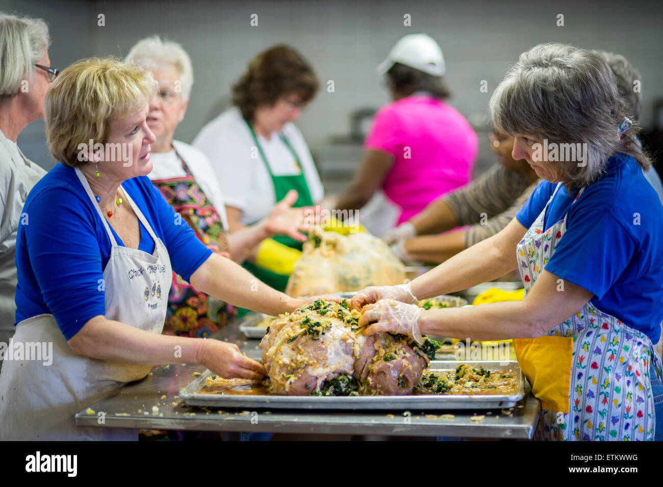 Women stuffing hams in St Mary's County Maryland, USA Stock Photo - Alamy